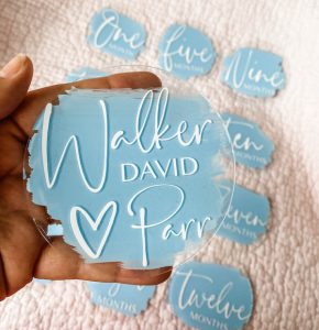 How to Make Acrylic Baby Milestone Discs with Cricut - Two Mama Bears
